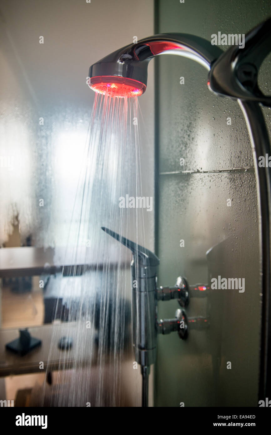 interior of a glass shower cabin with running water and moisture on ...