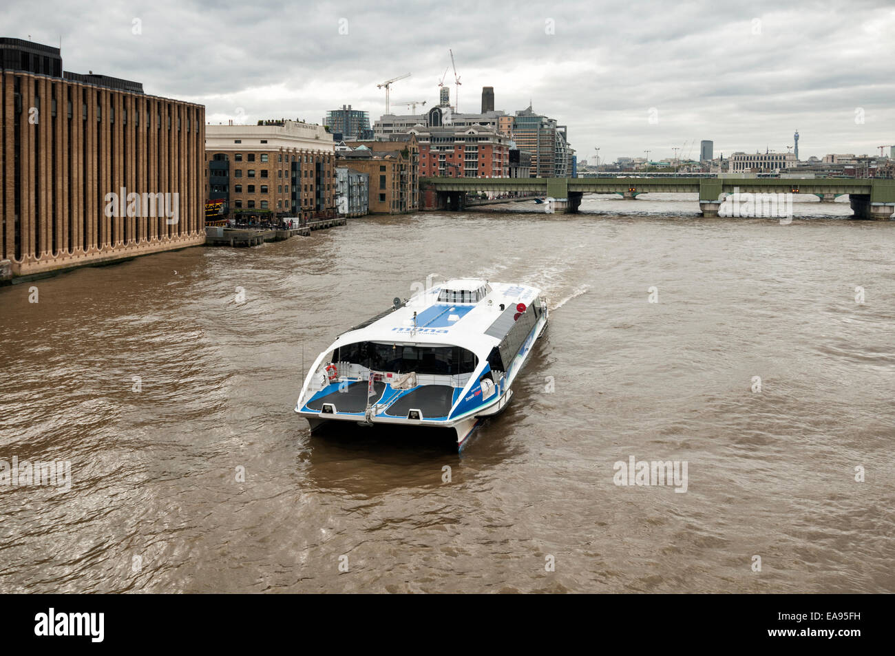 catamaran sightseeing trip for tourists on the River Thames in London ...