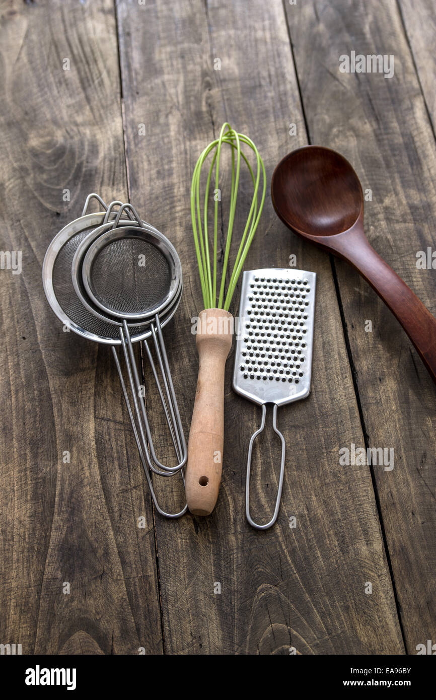 Kitchen Utensils on wooden table, close up Stock Photo - Alamy