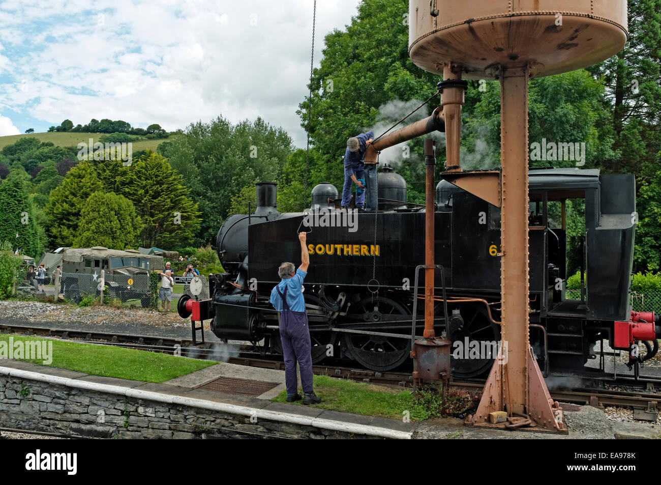 A ‘USA Class’ 0–6–0 dock tank engine on a water stop at the South Devon ...