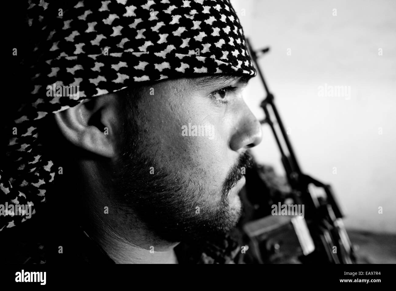 A Kurdish fighter of the People's Protection Units YPG wearing a ...