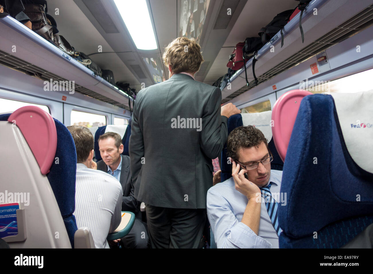 First Great Western train interior with male commuters Stock Photo - Alamy