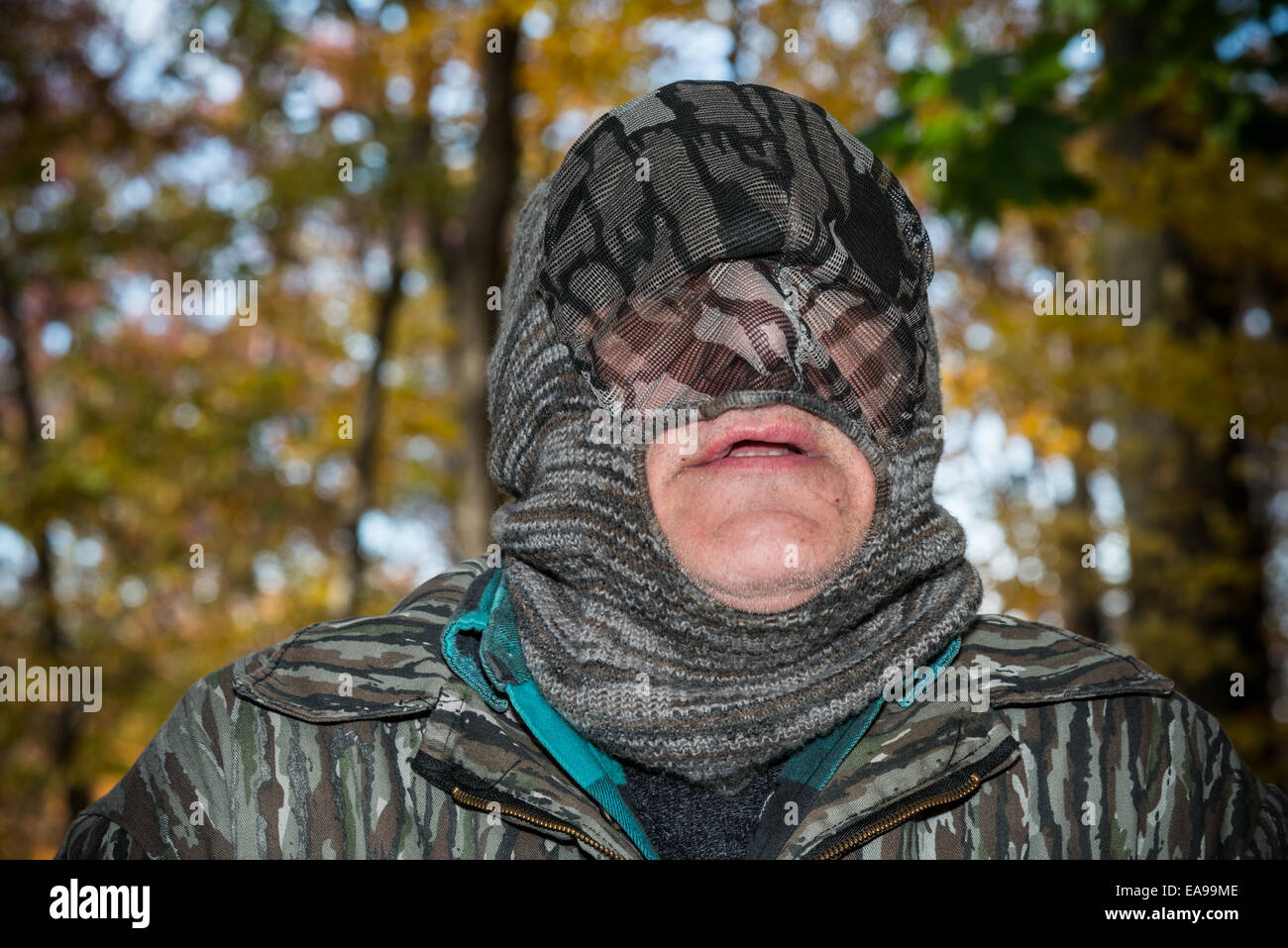 Camouflage Hooded Man Stock Photo - Alamy