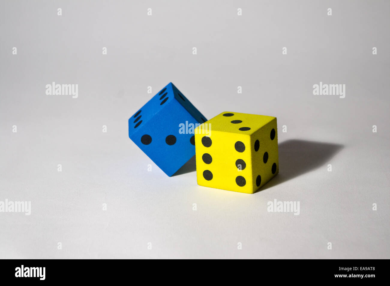 Blue and yellow foam dice Stock Photo - Alamy