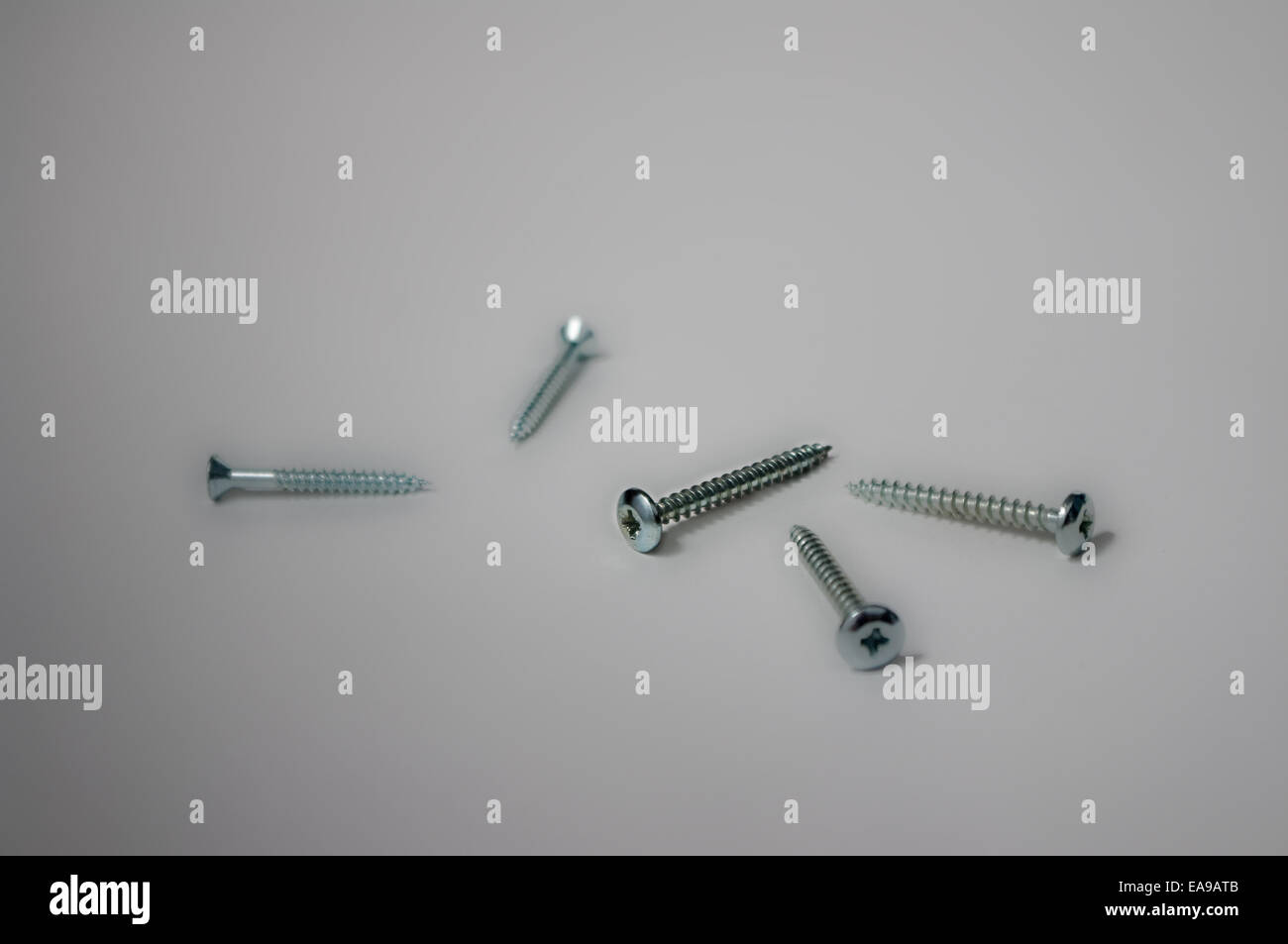Five screws with emphasis on the one in the middle Stock Photo - Alamy
