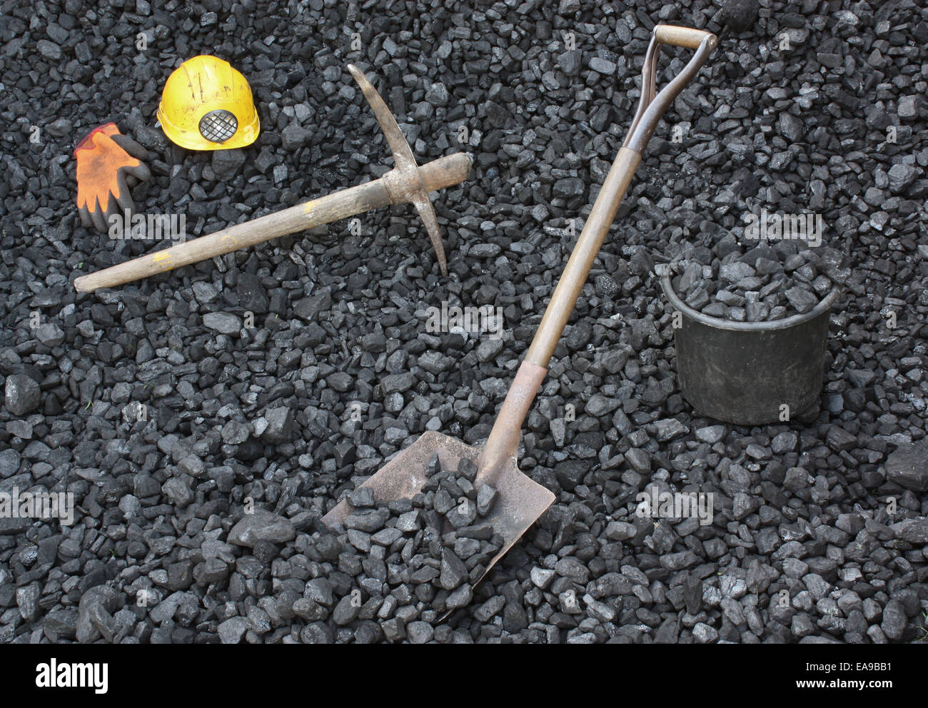 Mining tools on a background of coal Stock Photo - Alamy