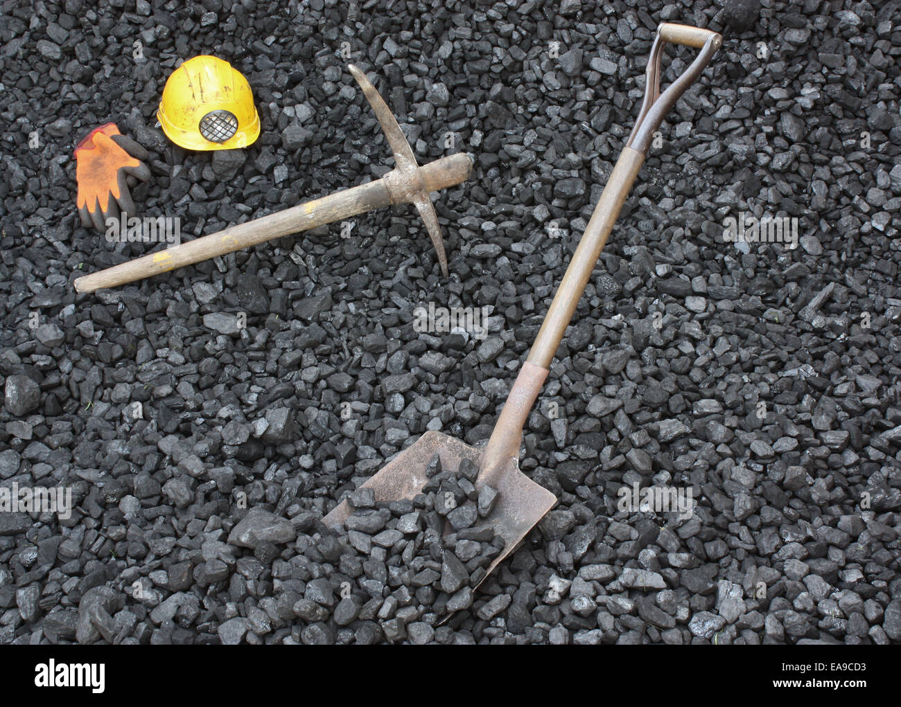 Mining tools on a background of coal Stock Photo - Alamy
