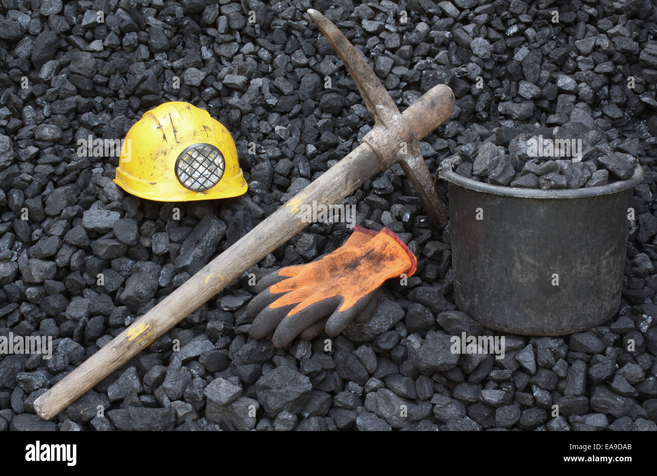 Mining tools on a background of coal Stock Photo - Alamy