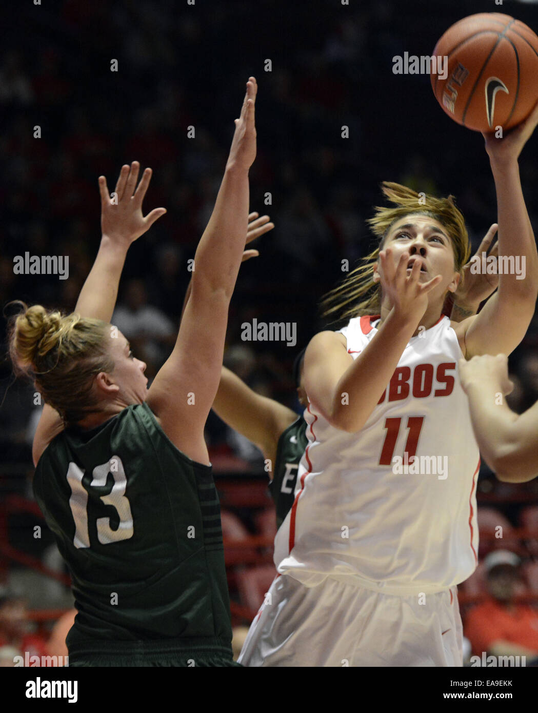Usa. 9th Nov, 2014. SPORTS -- UNM's Alexa Chavez, 11, shoots over ...