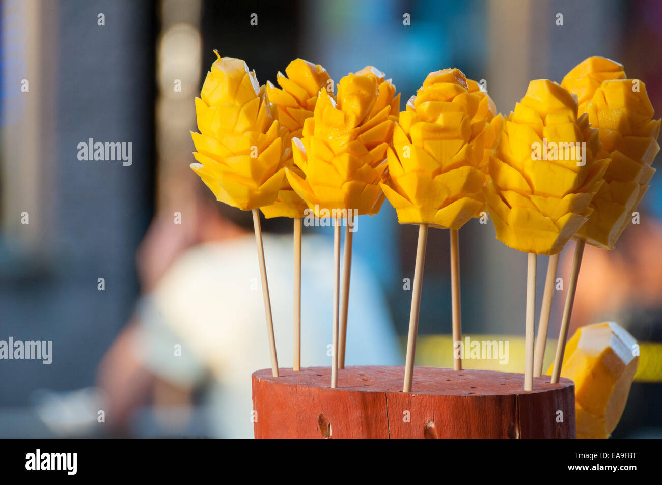 Mangoes on sticks Stock Photo - Alamy