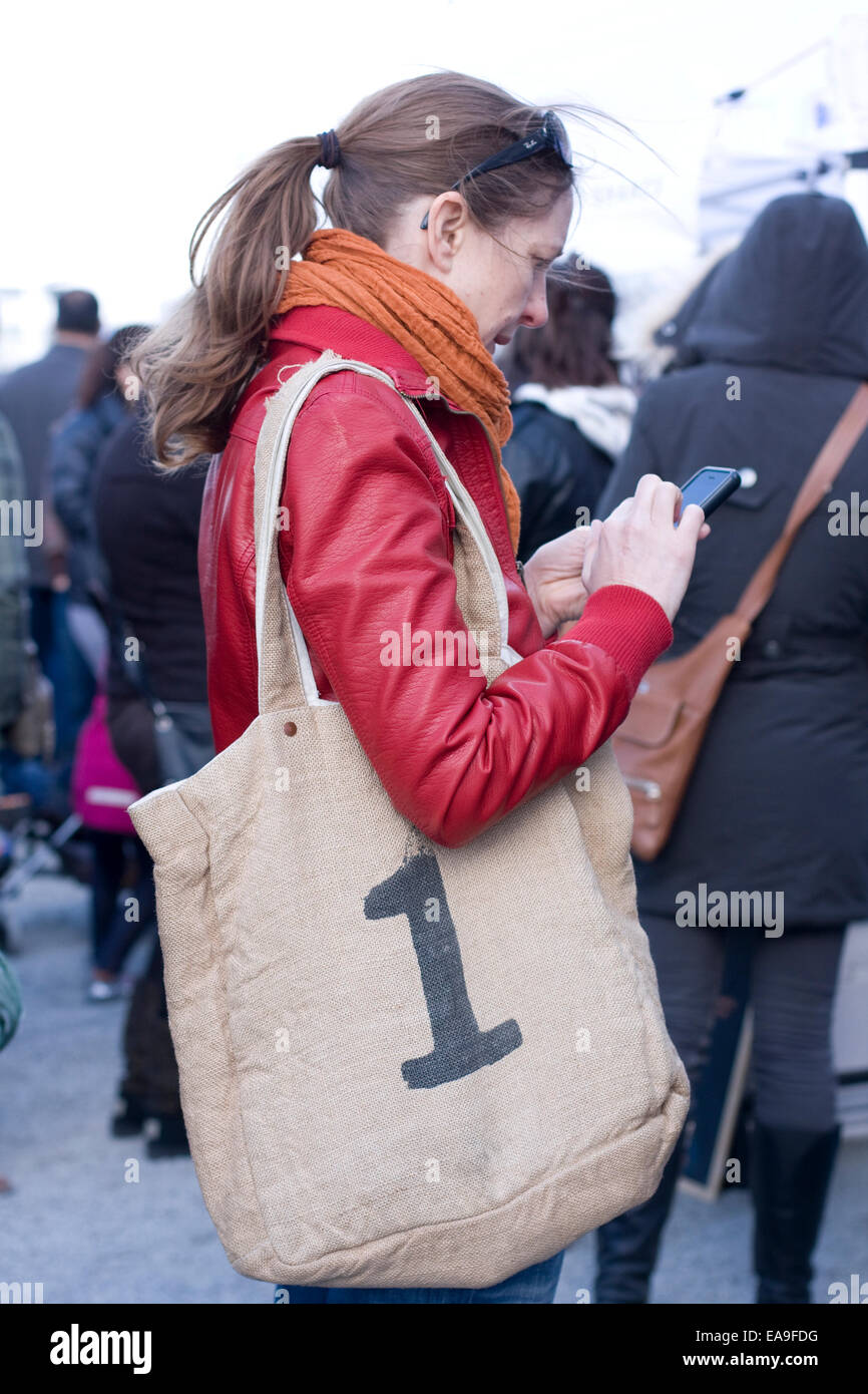Woman checking her phone Stock Photo - Alamy