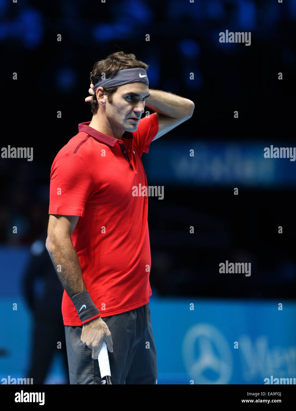 London, Britain. 9th Nov, 2014. Roger Federer of Switzerland reacts ...