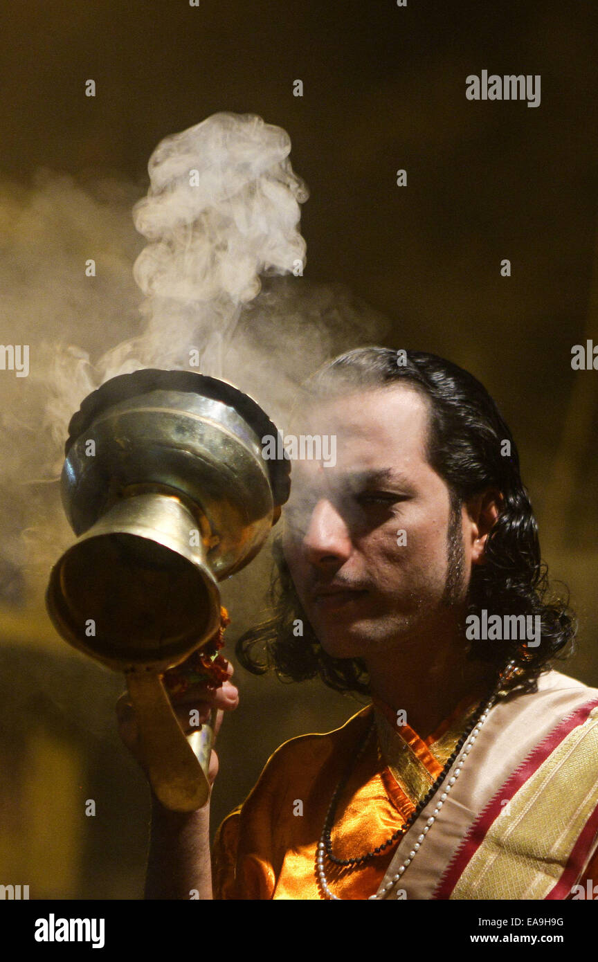 Varanasi, Uttar Pradesh. 9th Nov, 2014. A Hindu devotee performs the ...