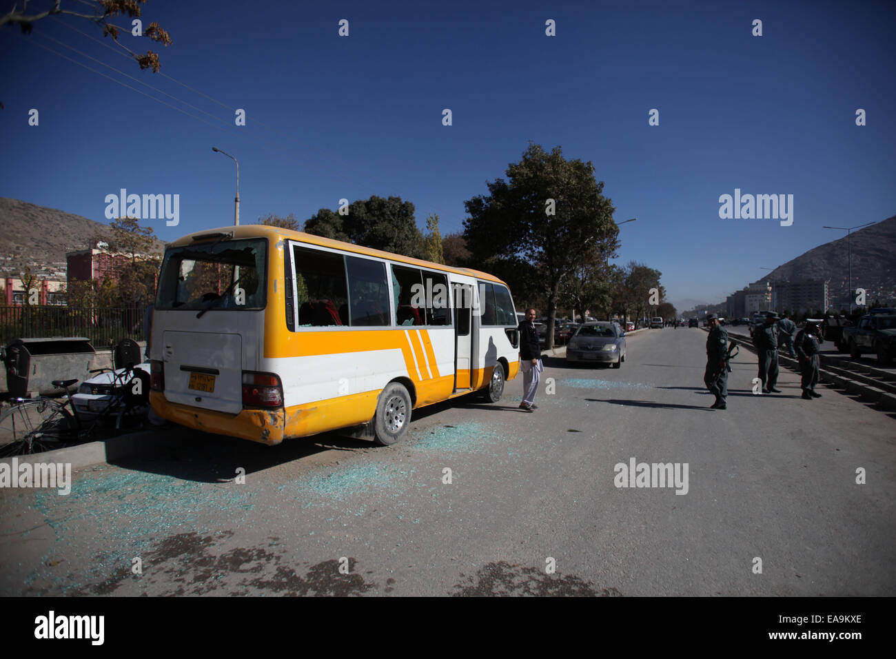 Kabul, Afghanistan. 10th Nov, 2014. Afghans gather around a damaged bus ...
