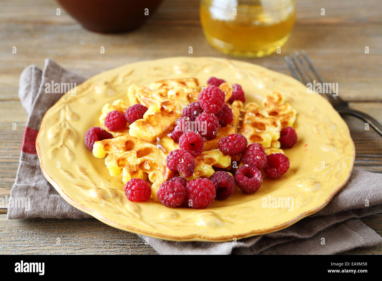 Homemade waffles and raspberries, tasty food Stock Photo - Alamy