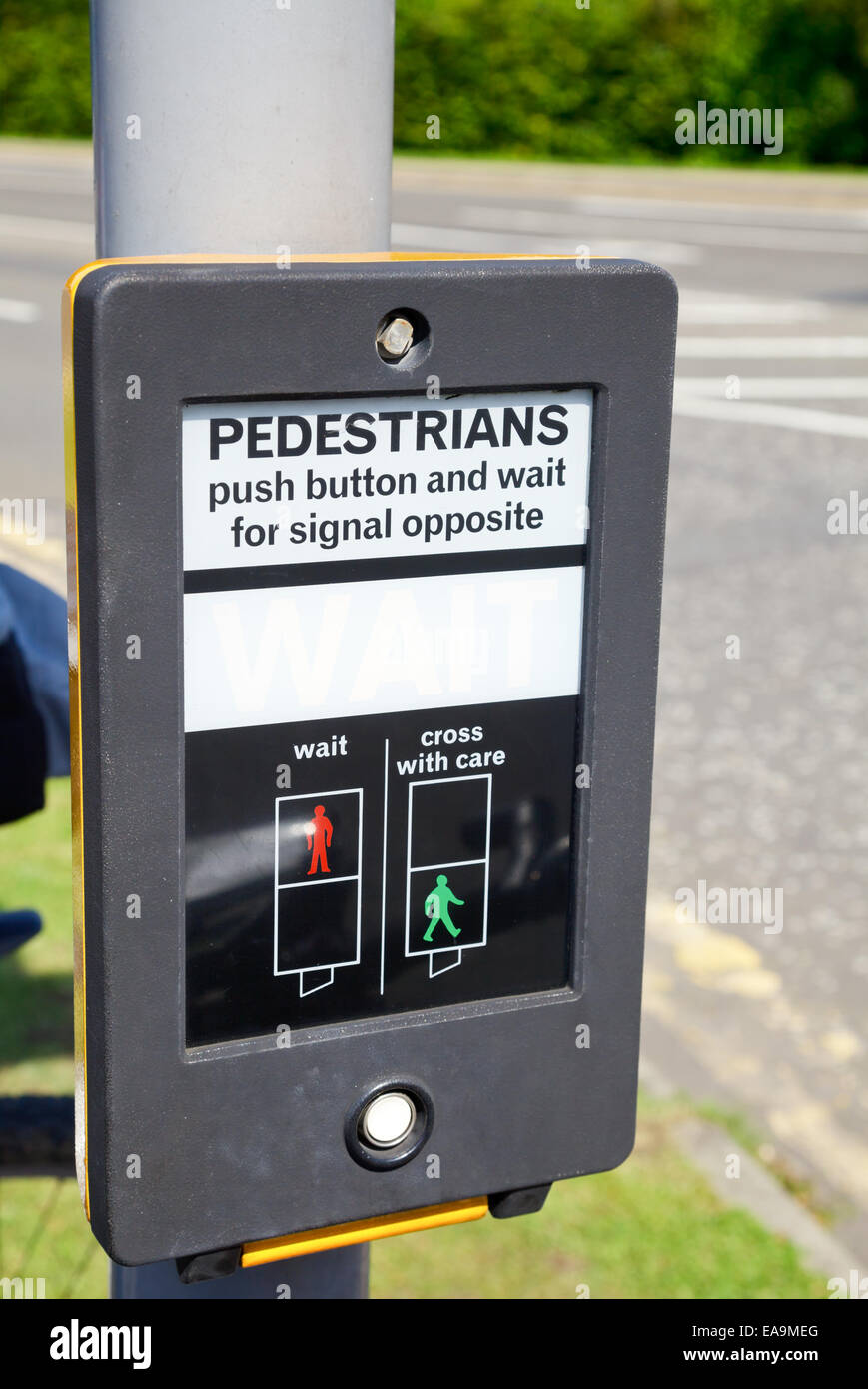 British pedestrian crossing button with wait sign Stock Photo - Alamy