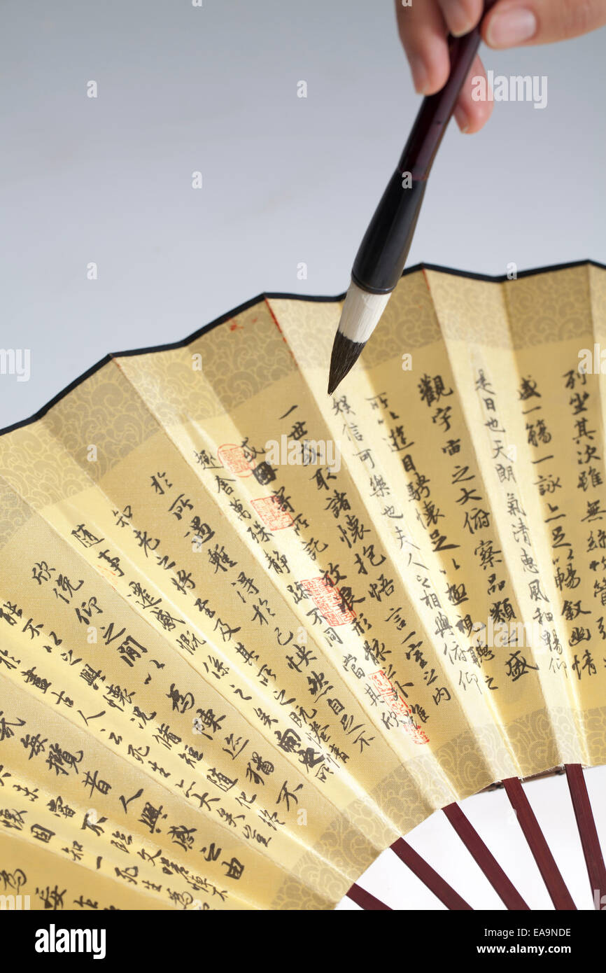Fan and Chinese calligraphy Stock Photo - Alamy
