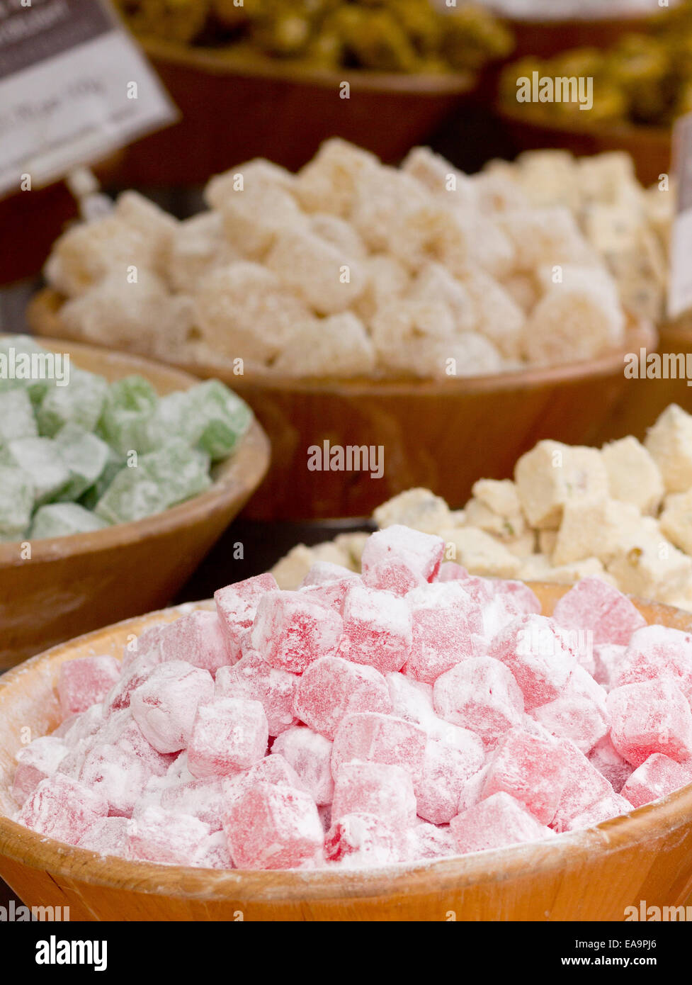 Pink turkish Delight covered in icing sugar in a bowl - at a street ...