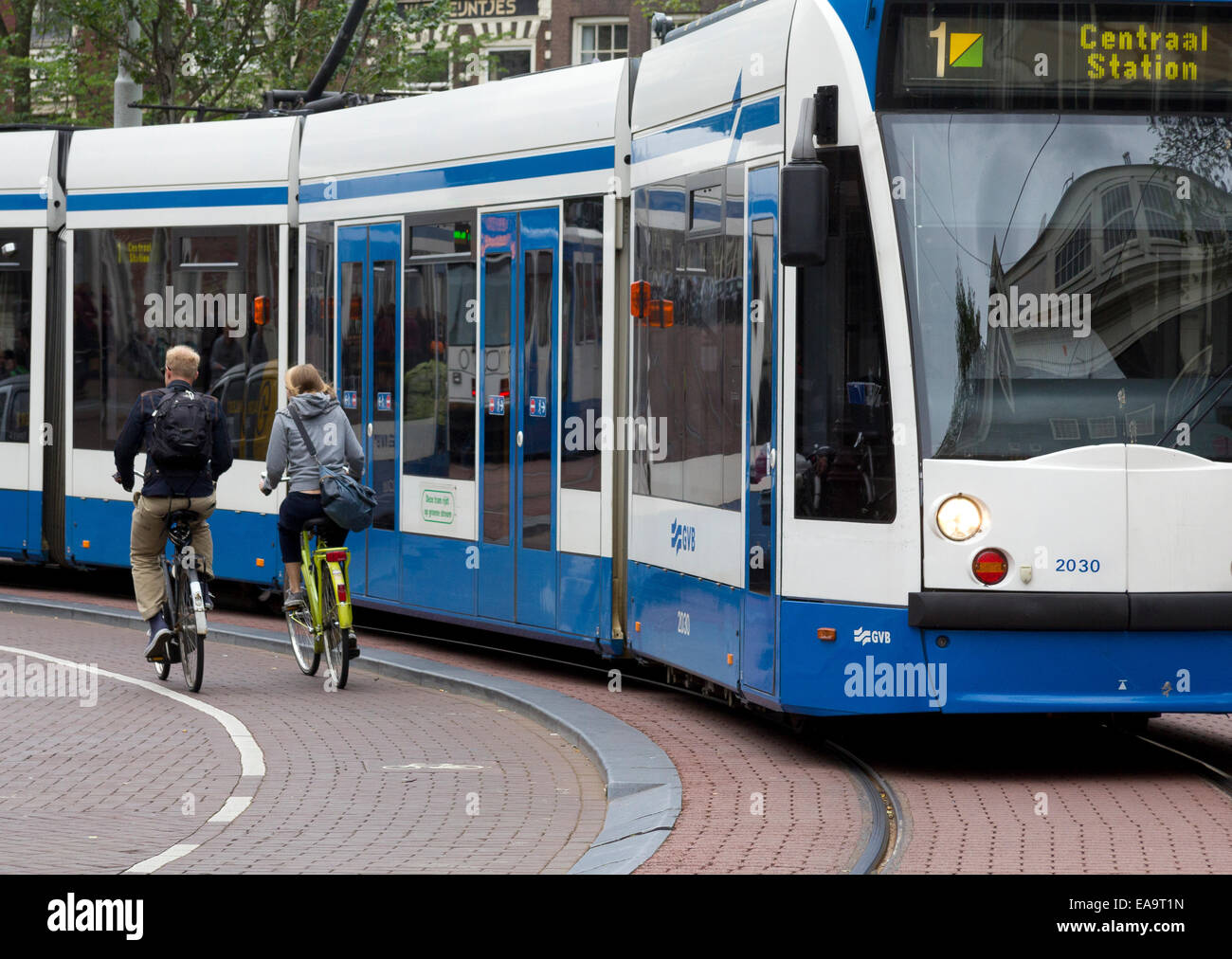 Amsterdam, The Netherlands. A cycle lane close to a moving tram Stock ...