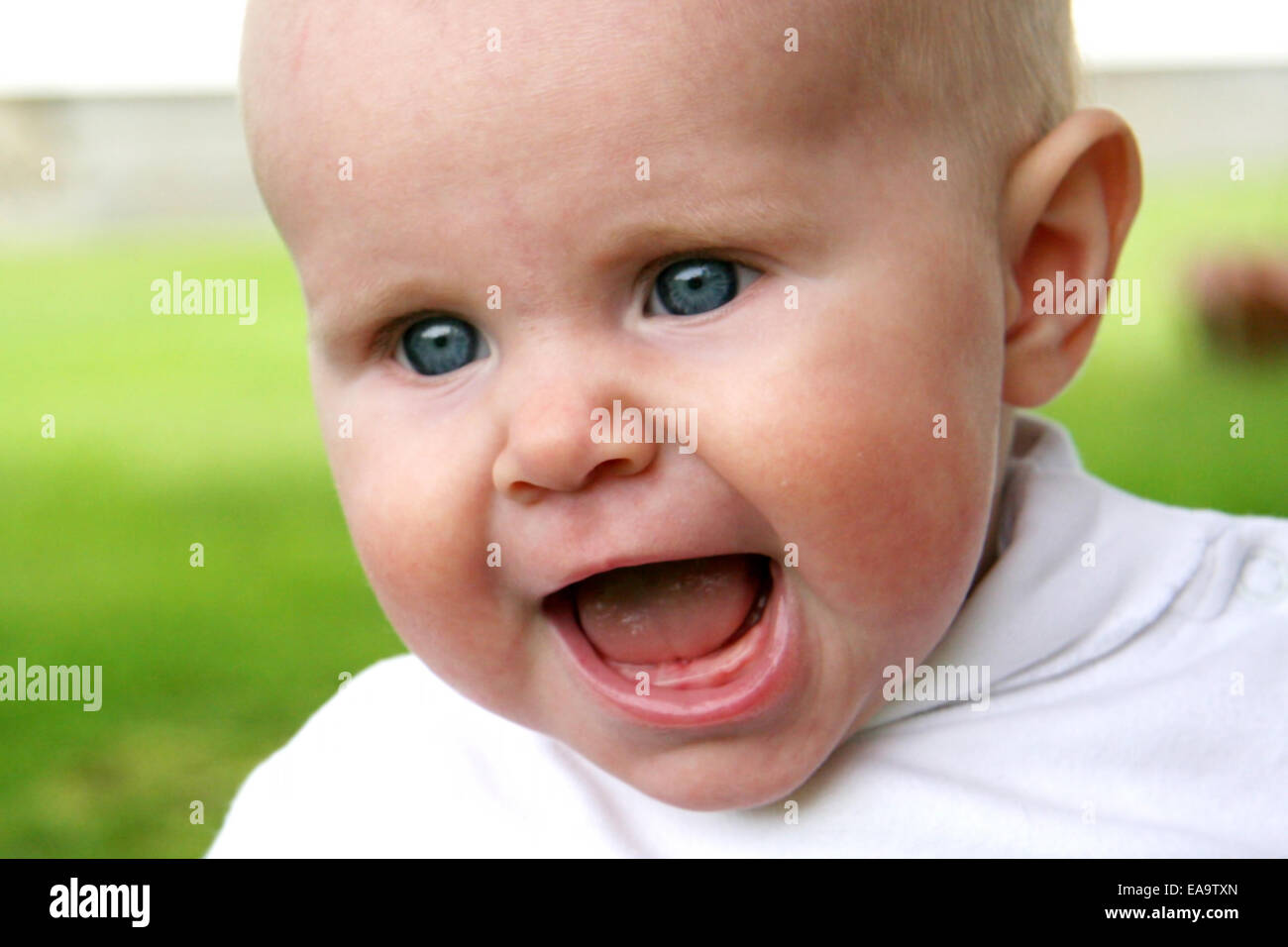 Baby taken closeup with mouth open Stock Photo - Alamy