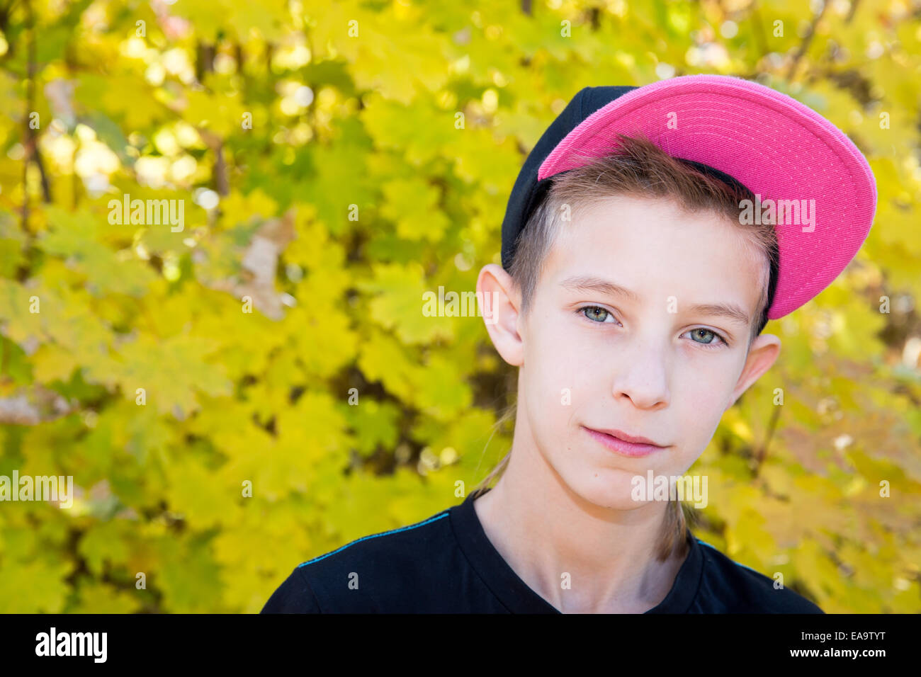 Fall. boy teenager with leaves in autumn park Stock Photo - Alamy
