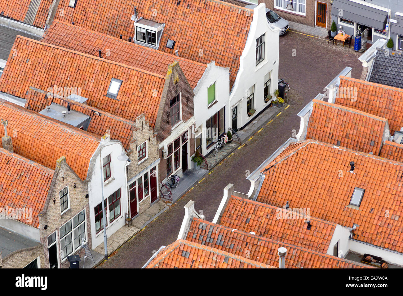 Overhead view of the tiled rooftops of typical Dutch homes in the town ...