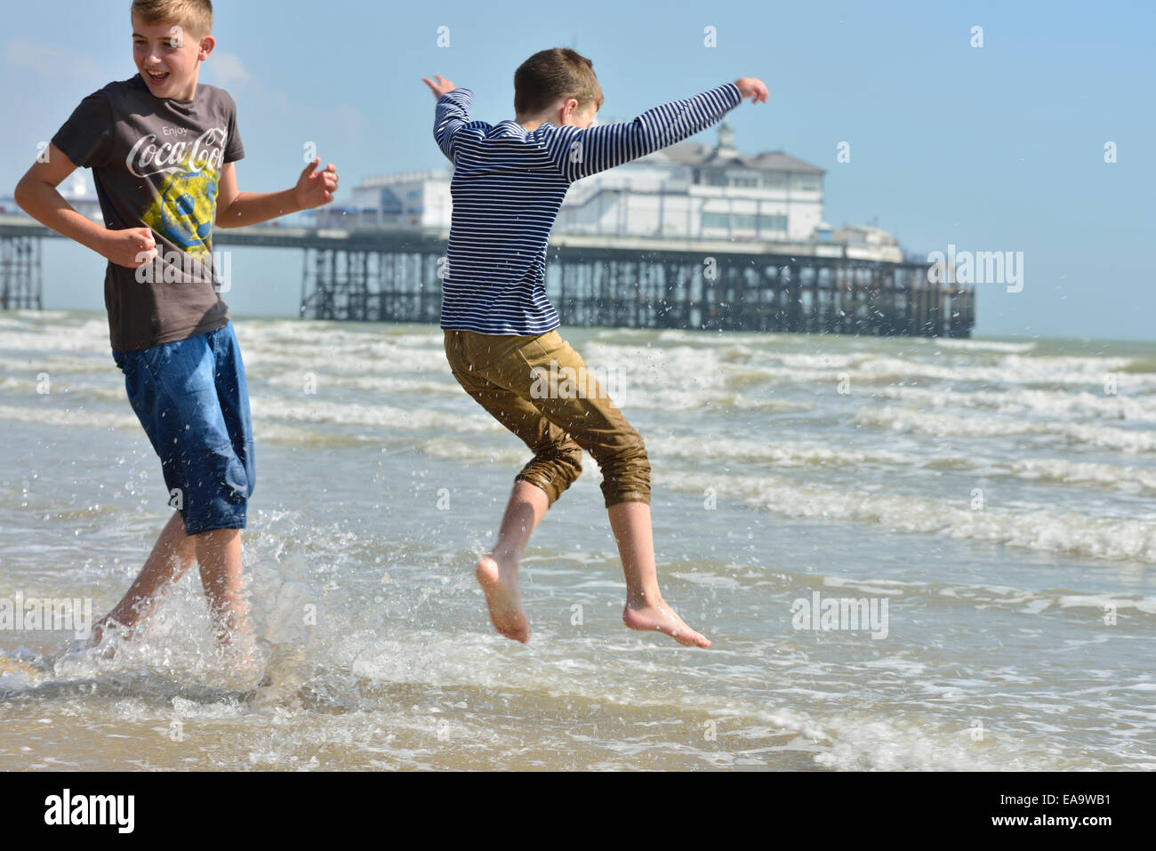 Running boys hi-res stock photography and images - Alamy