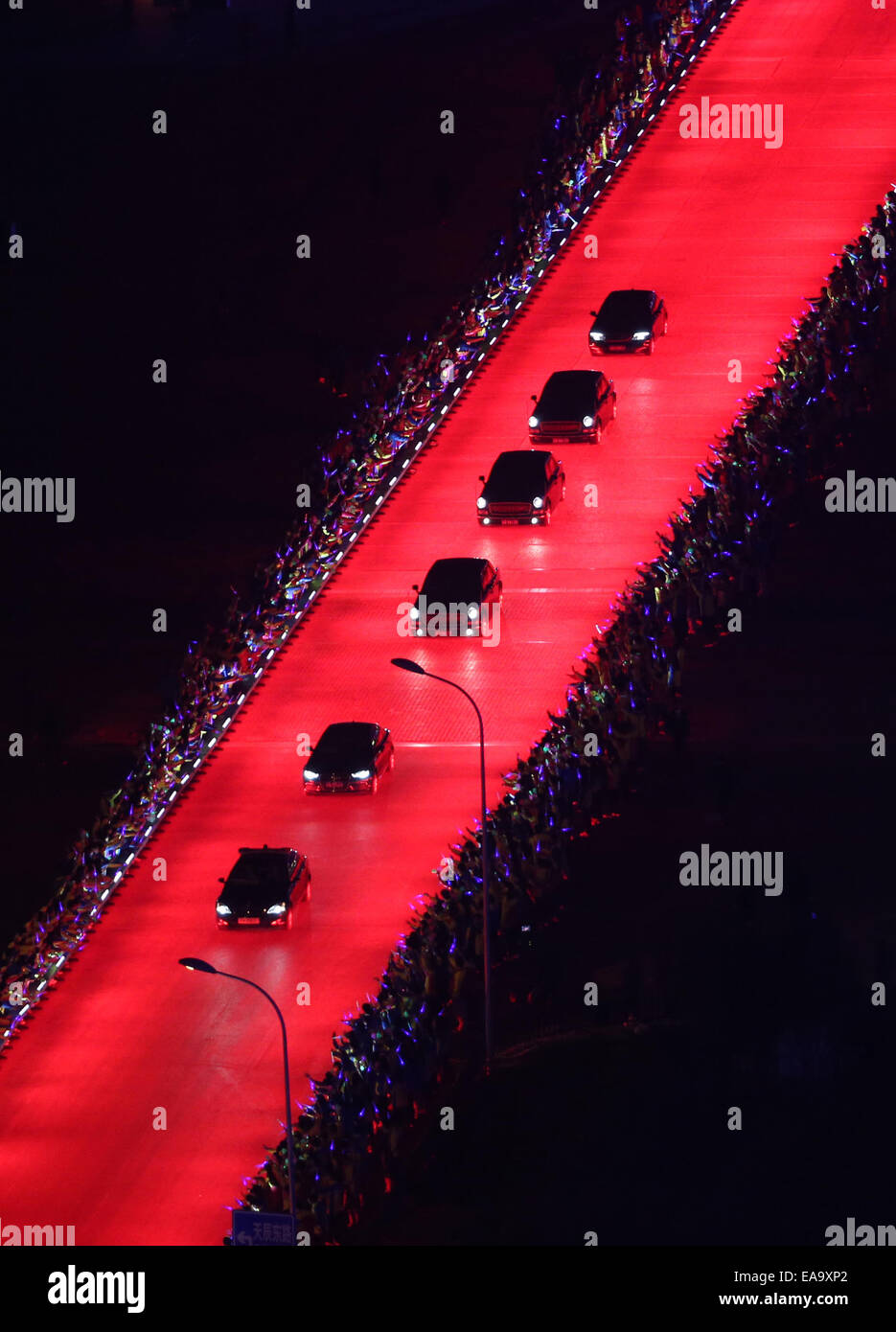 Beijing, China. 10th Nov, 2014. A motorcade arrives at the National ...