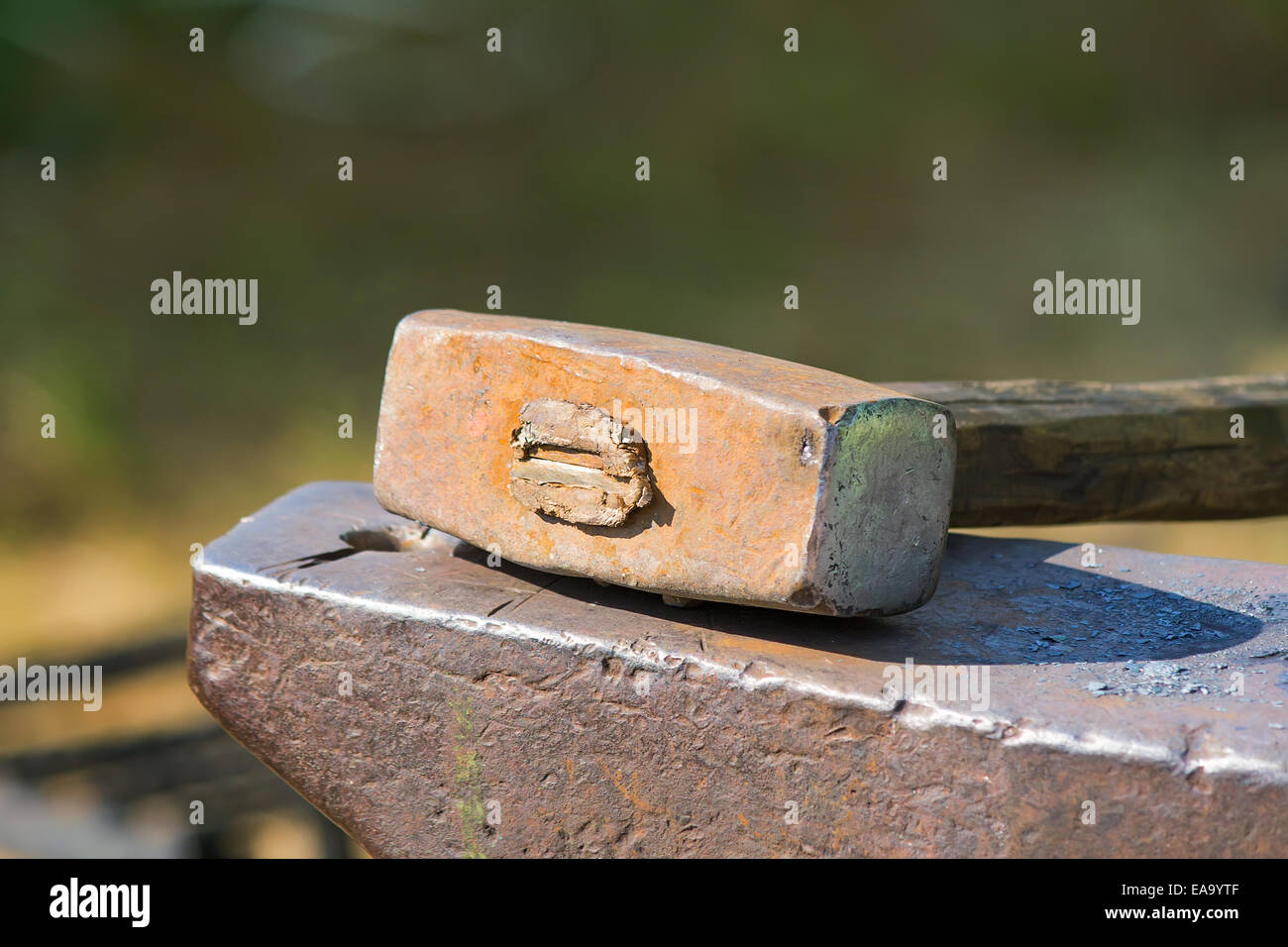 Vintage small hammer and anvil for forging metal Stock Photo - Alamy