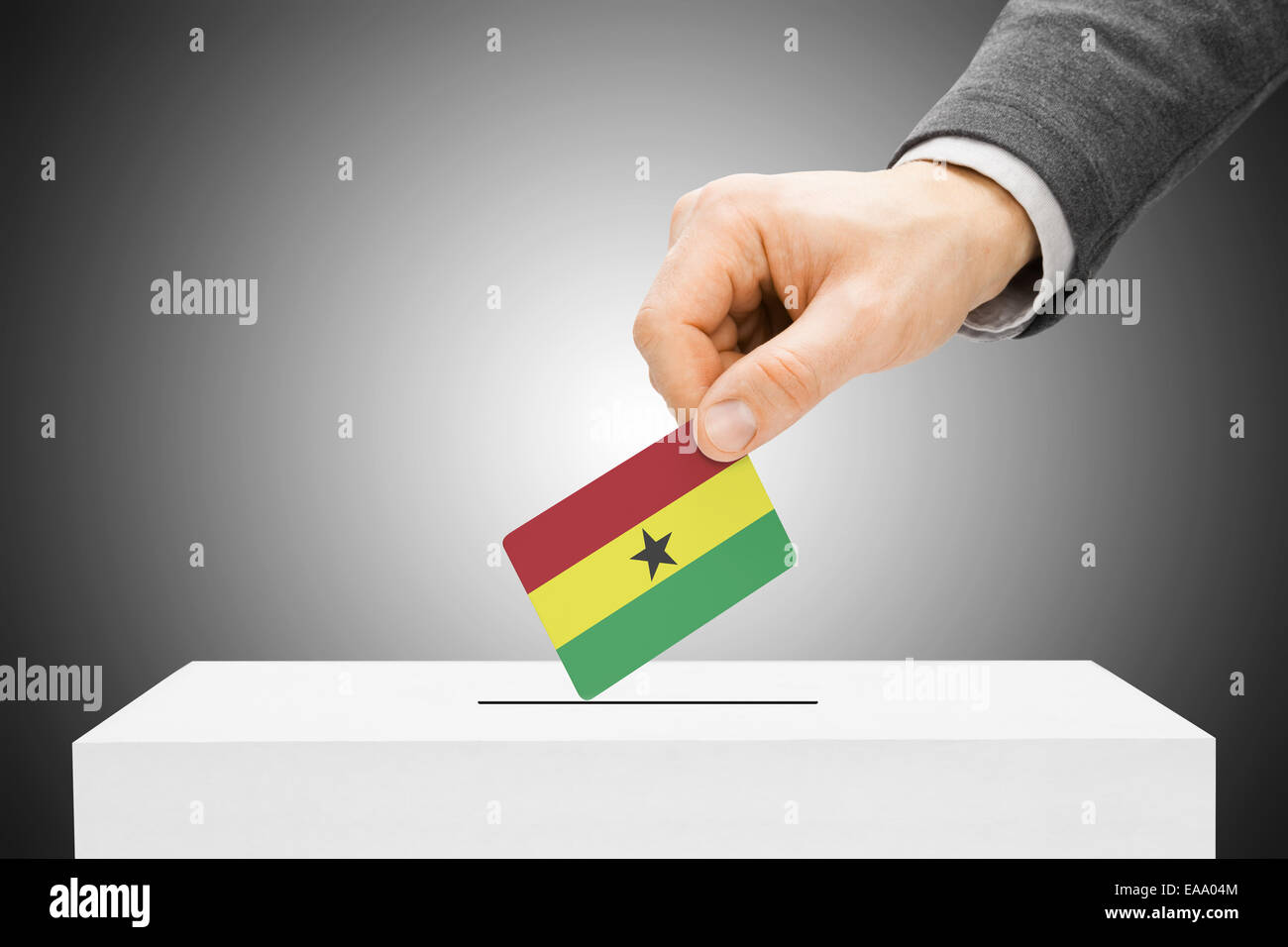 Voting concept - Male inserting flag into ballot box - Ghana Stock ...