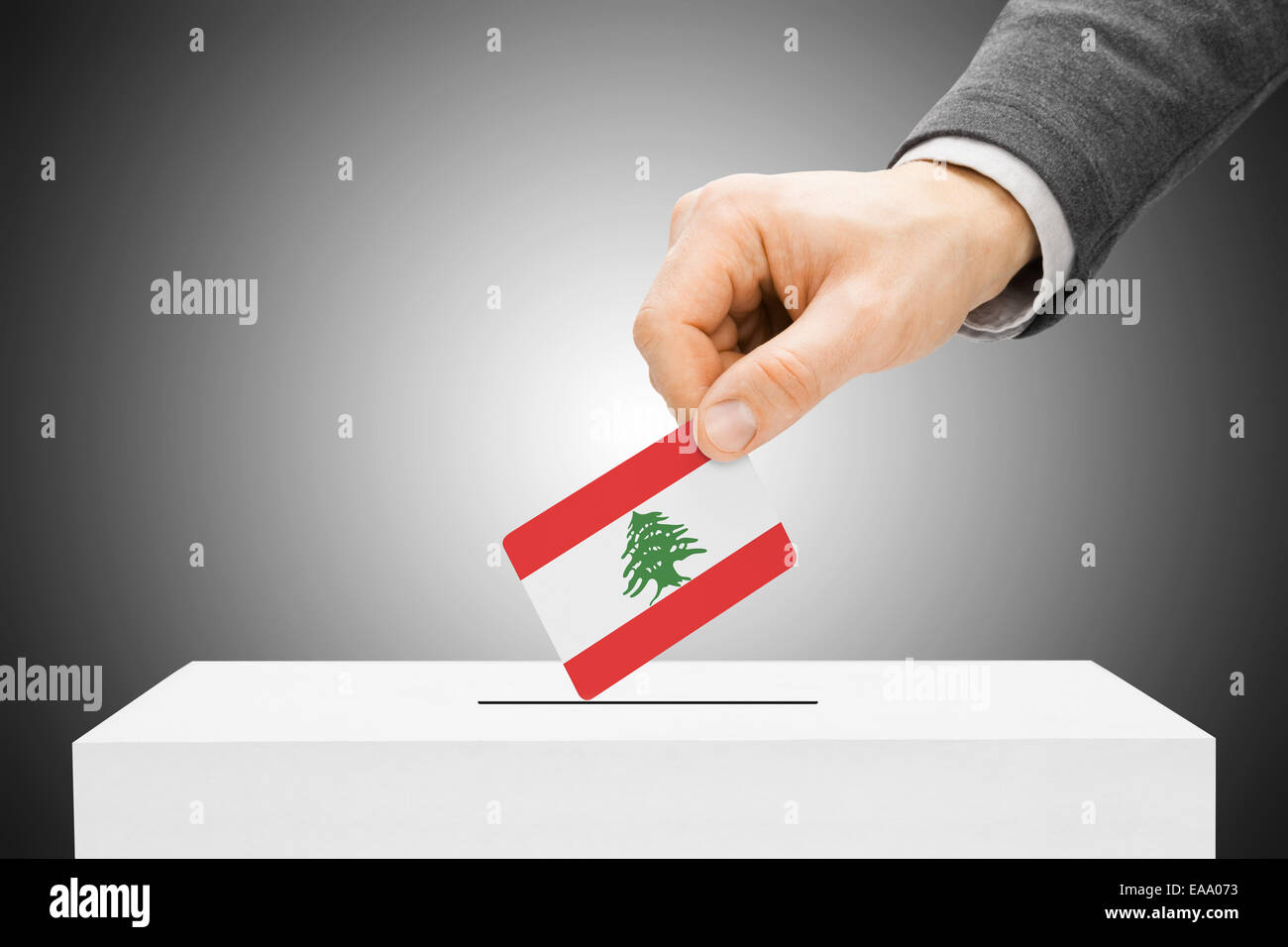 Voting concept - Male inserting flag into ballot box - Lebanon Stock ...