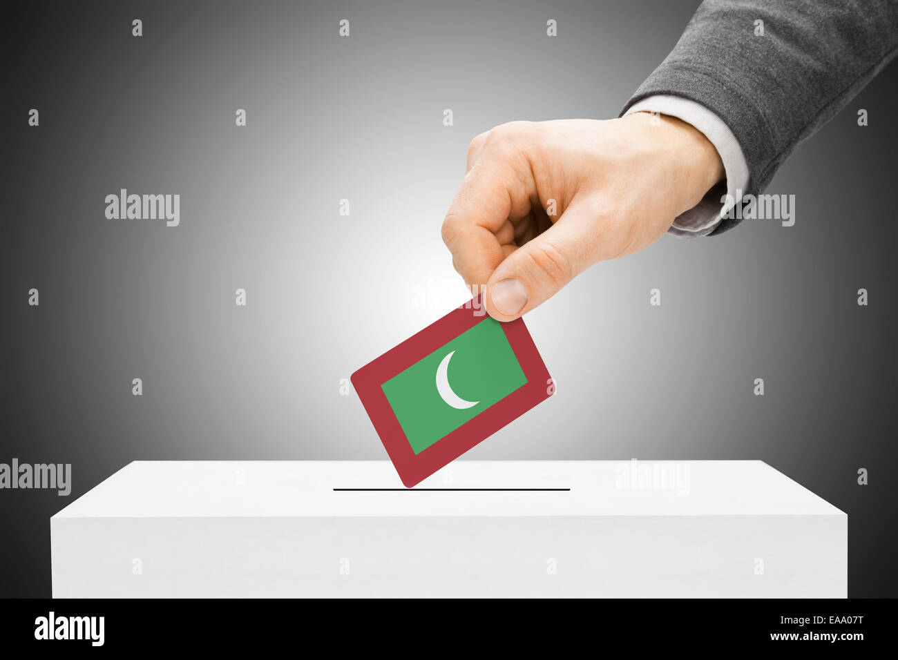 Voting concept - Male inserting flag into ballot box - Maldives Stock ...