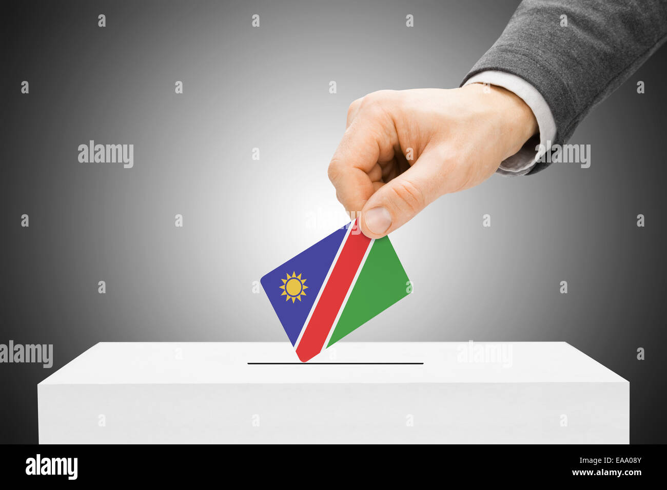 Voting concept - Male inserting flag into ballot box - Namibia Stock ...