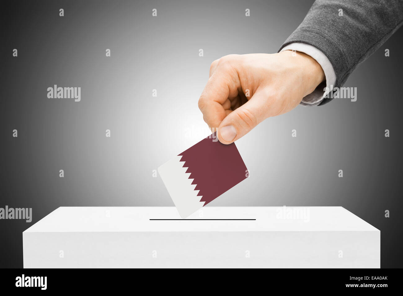 Voting concept - Male inserting flag into ballot box - Qatar Stock ...