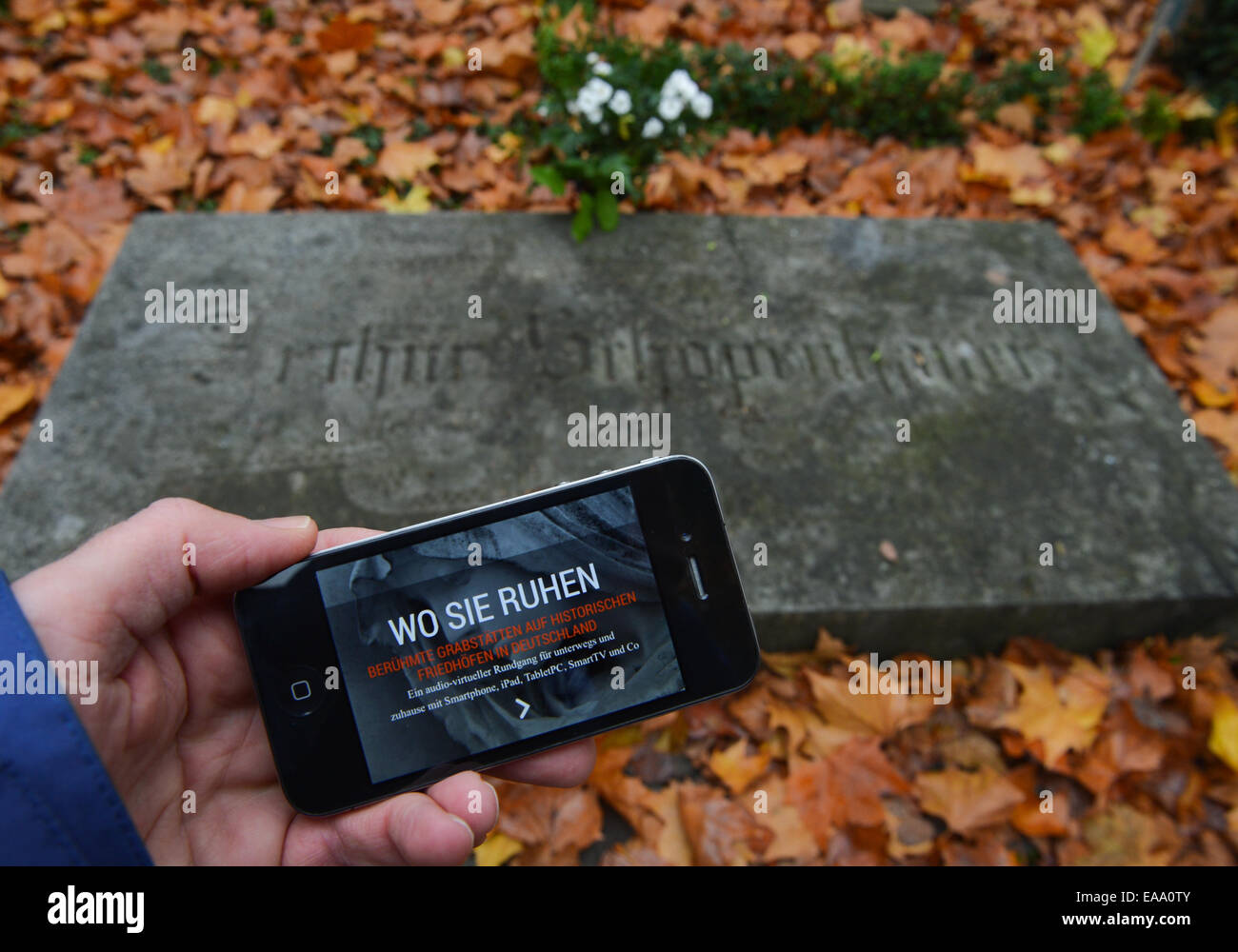 ILLUSTRATION - A hand holds up a smartphone in front of of the ...