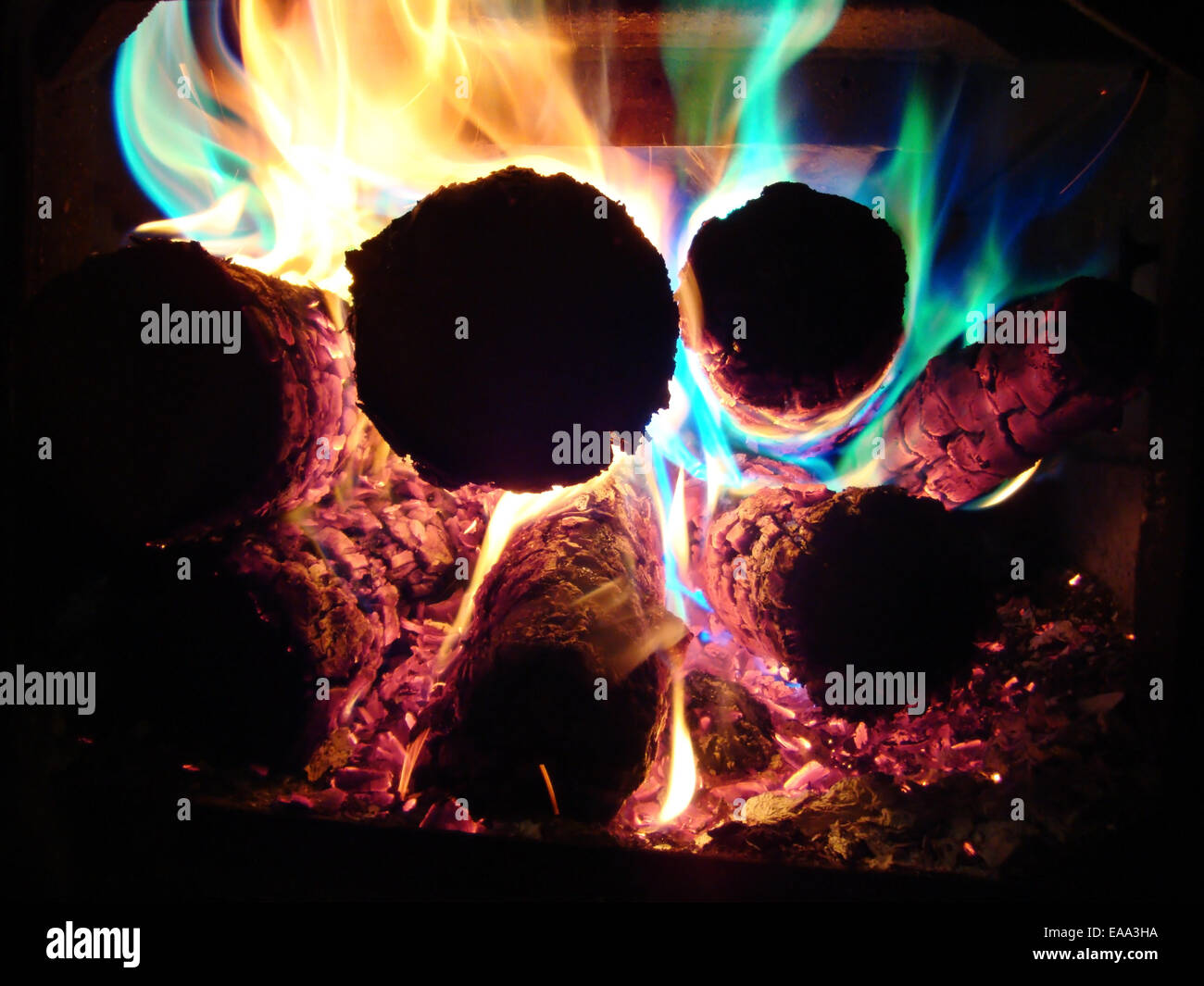 Fire in Fireplace with red and blue flames Stock Photo - Alamy