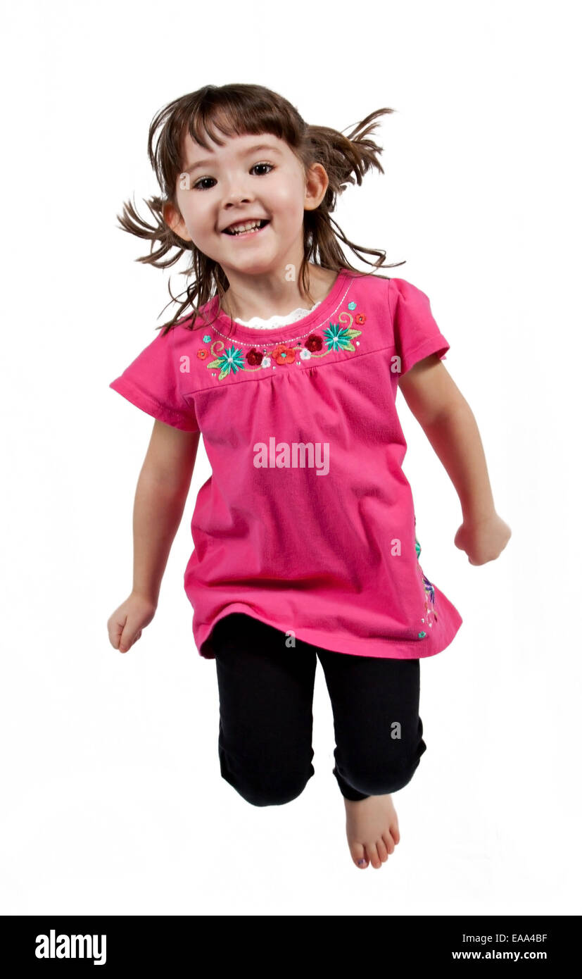 Adorable and happy little girl jumping in air. isolated on white ...