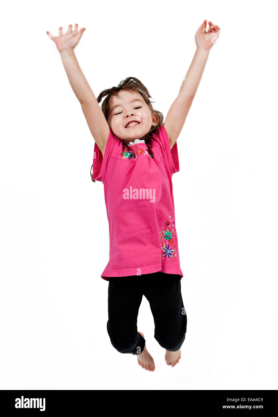 Adorable and happy little girl jumping in air. isolated on white ...