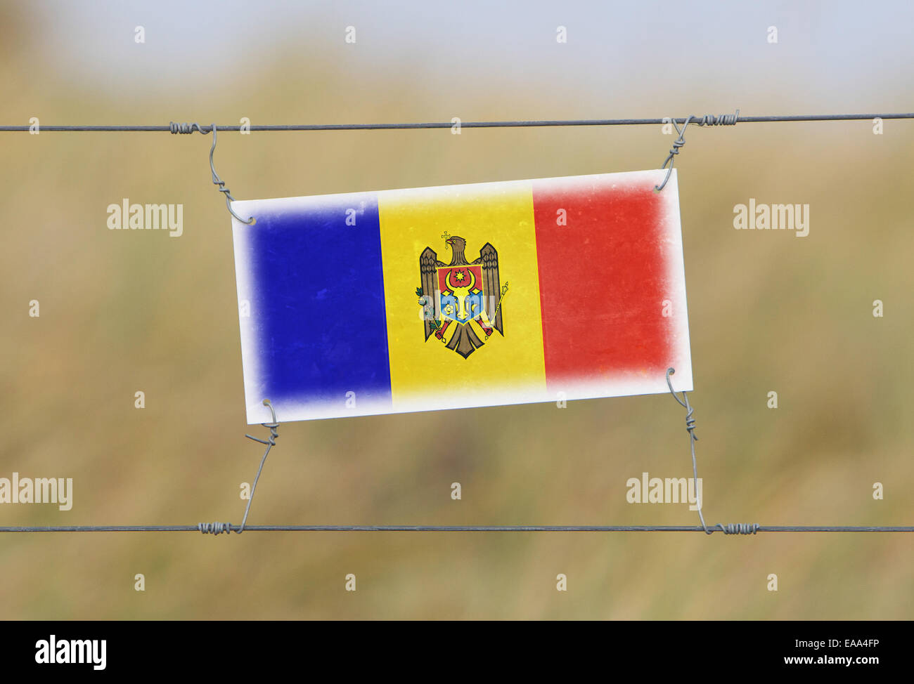 Border fence - Old plastic sign with a flag - Moldova Stock Photo - Alamy