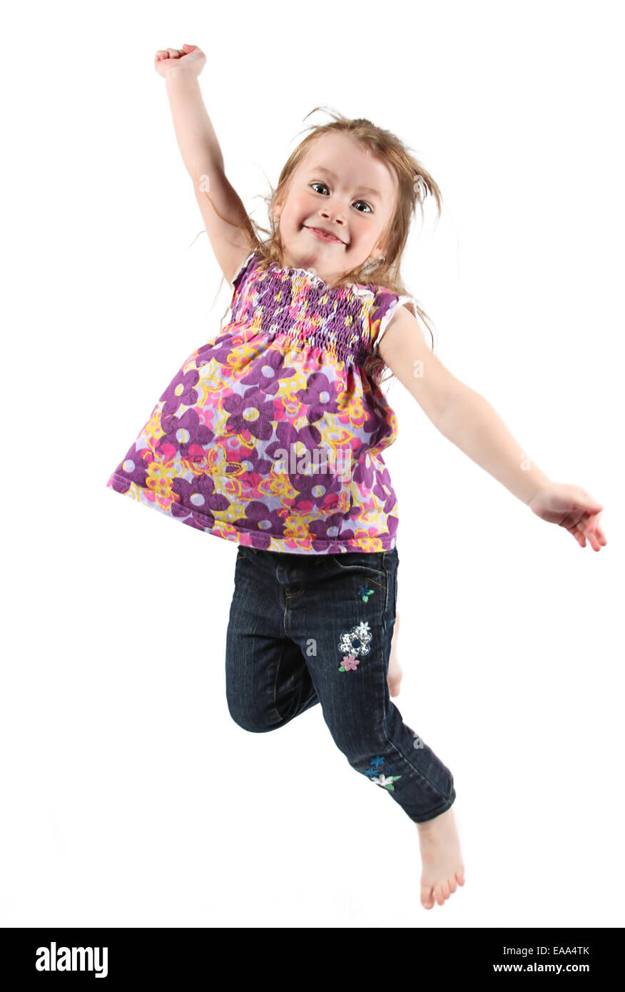 Adorable and happy little girl jumping in air. isolated on white ...