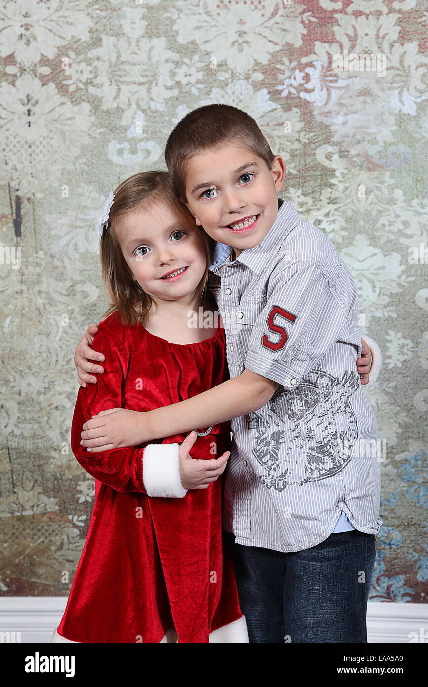 Adorable little brother and Sister on studio background Stock Photo - Alamy