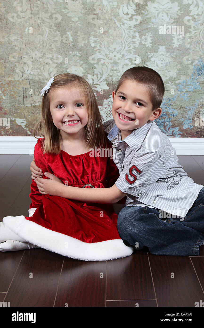Adorable little brother and Sister on studio background Stock Photo - Alamy