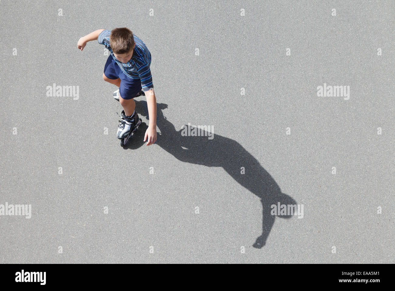 boy roller skating, top view Stock Photo - Alamy