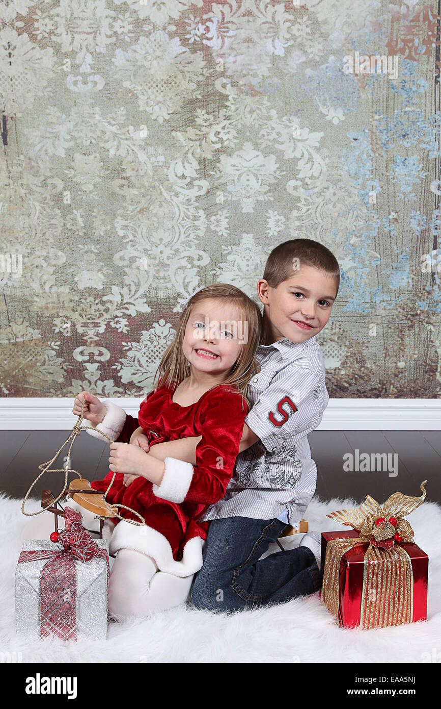Adorable little brother and Sister on studio background Stock Photo - Alamy