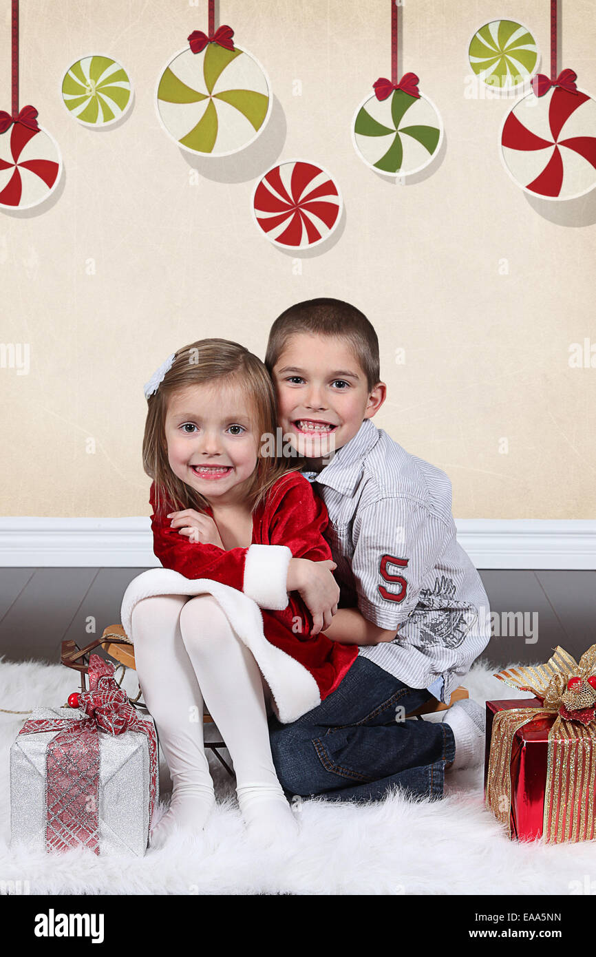 Adorable little brother and Sister on studio background Stock Photo - Alamy