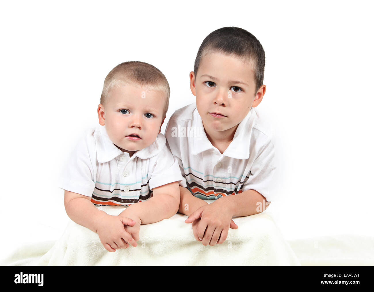 Adorable little brother and Sister on studio background Stock Photo - Alamy