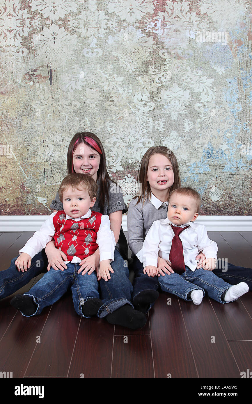 Adorable little brother and Sister on studio background Stock Photo - Alamy
