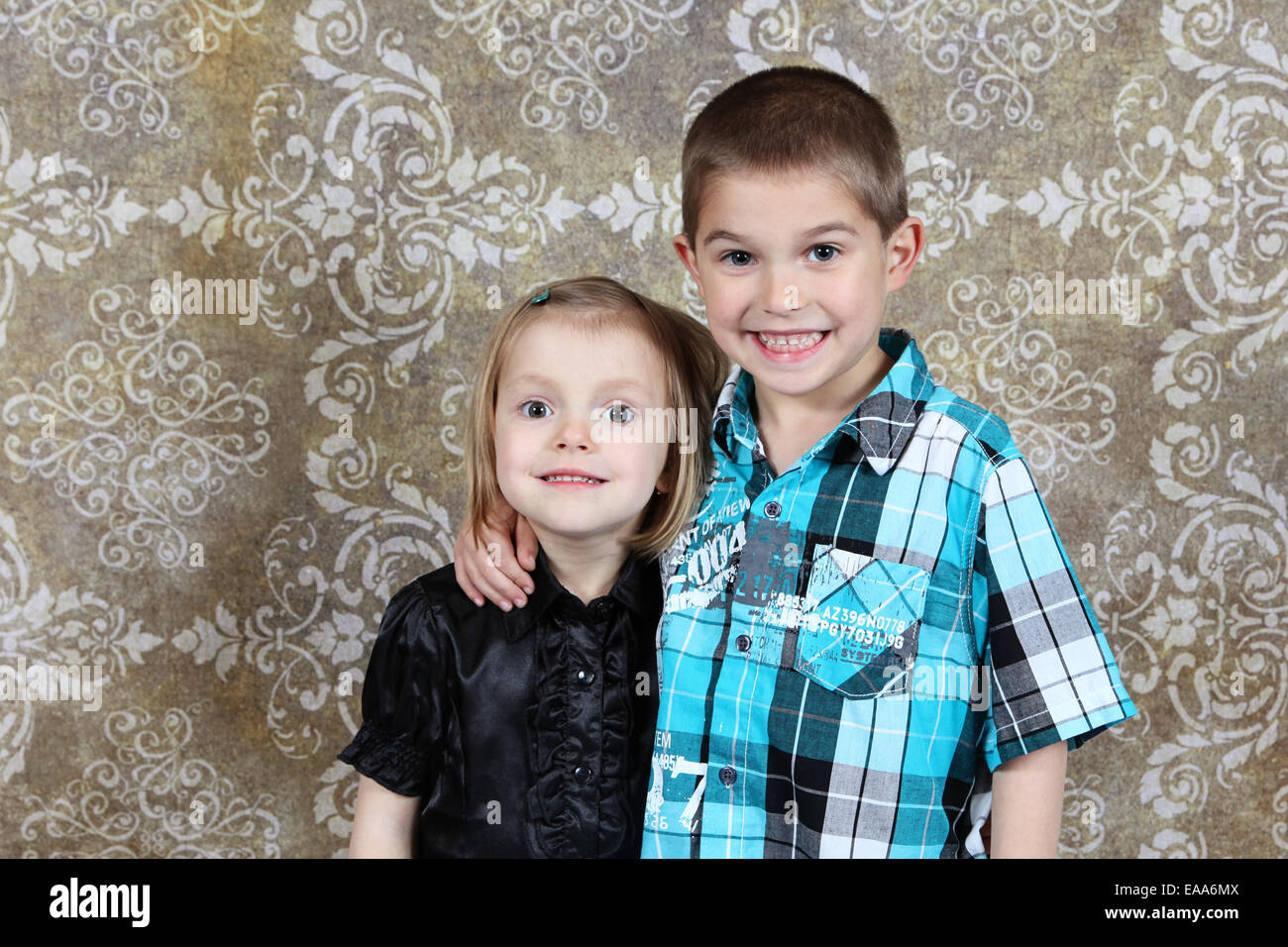 Adorable little brother and Sister on studio background Stock Photo - Alamy