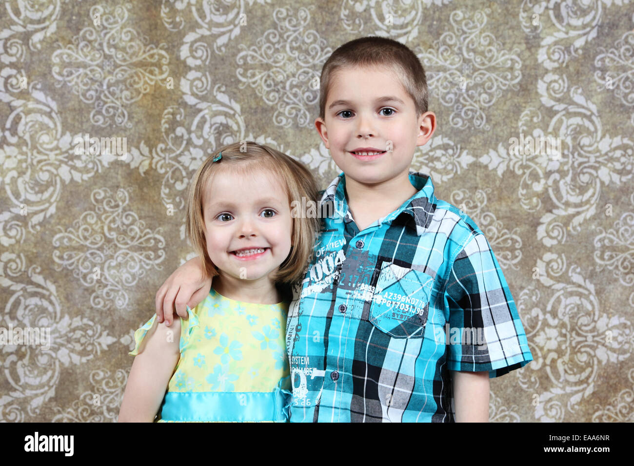 Adorable little brother and Sister on studio background Stock Photo - Alamy