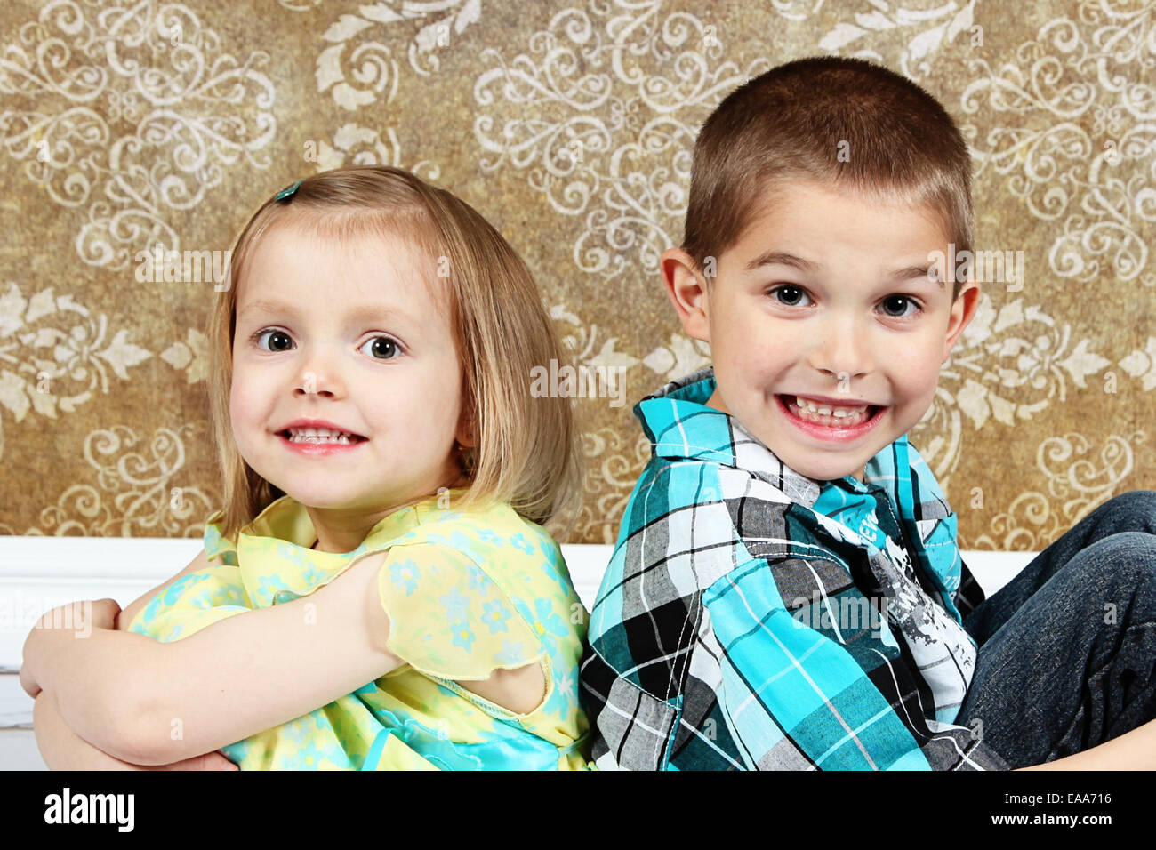 Adorable little brother and Sister on studio background Stock Photo - Alamy